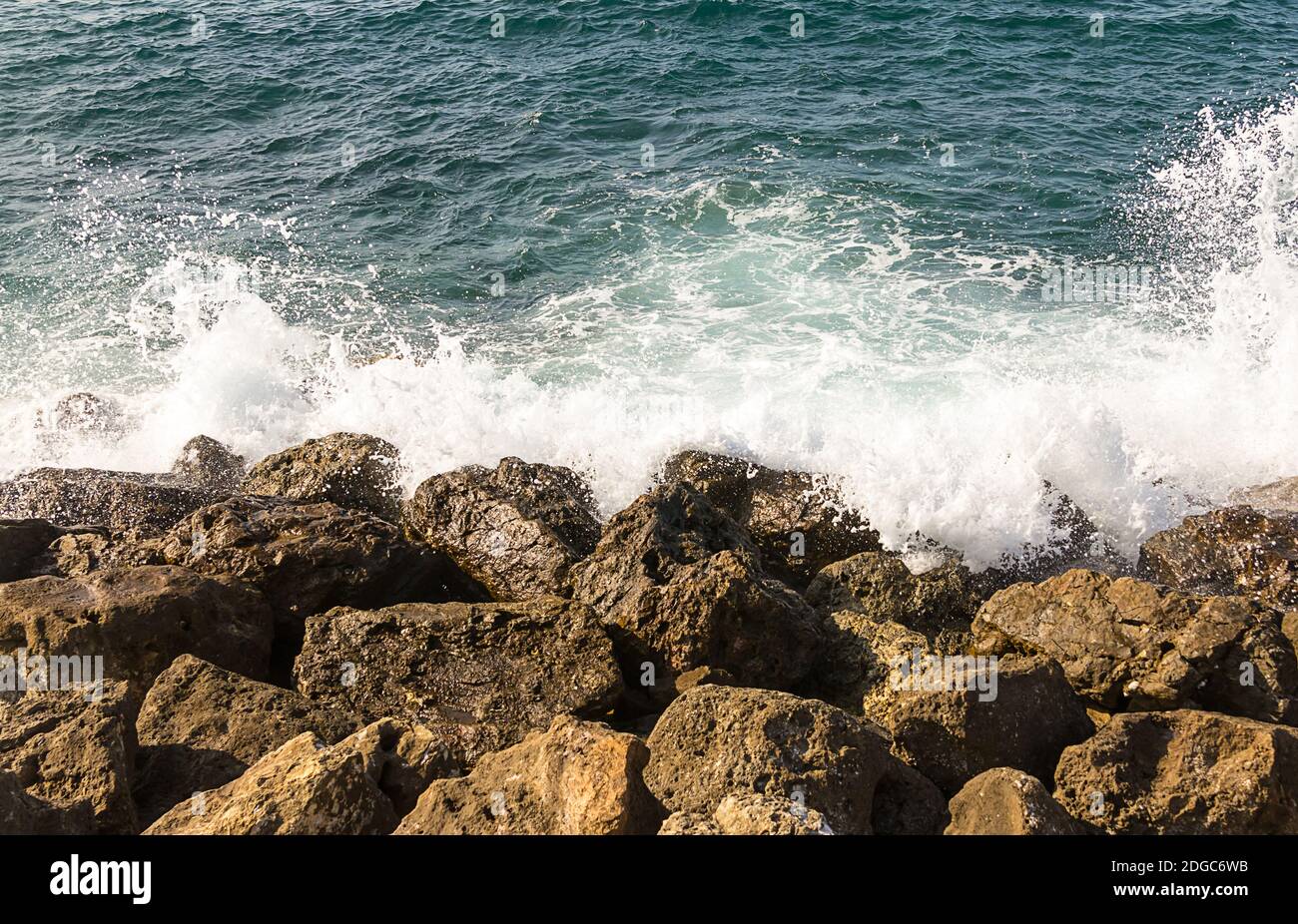 Azure sea white wave is broken about the shore brown stones greece crit ...