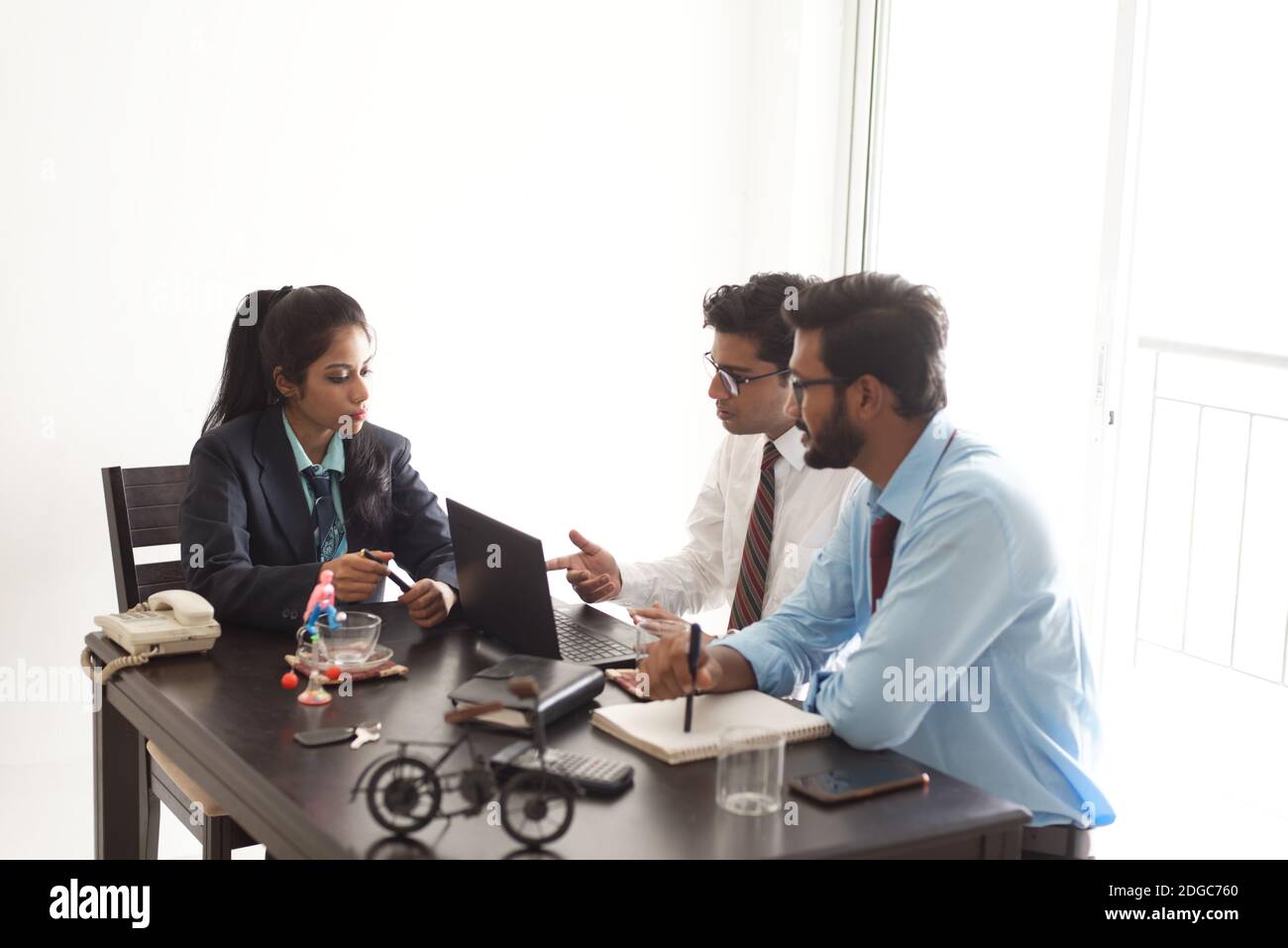 Young and energetic subordinates are discussing with female boss in ...