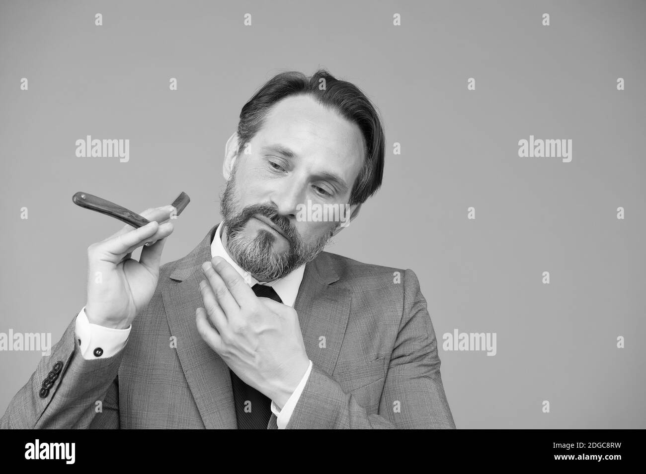Man shaving straight razor grooming beard, skillful barber concept ...