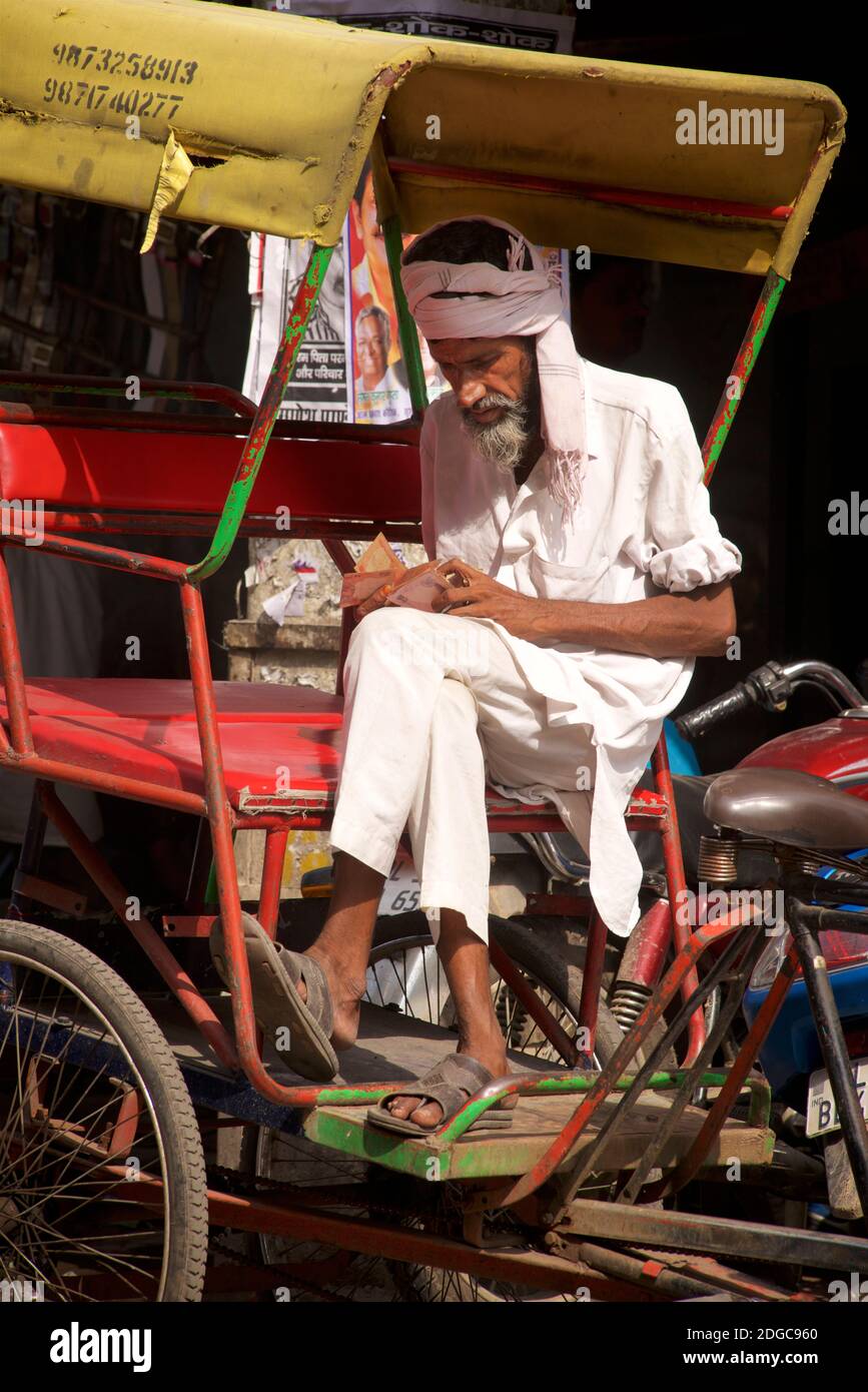 Indian rickshaw driver waiting for business, Chandi Chowk market, Old ...