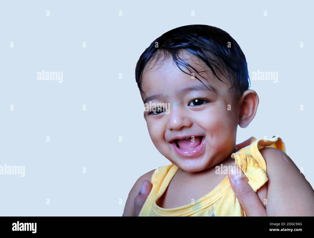 An adorable child smiling at someone Stock Photo - Alamy