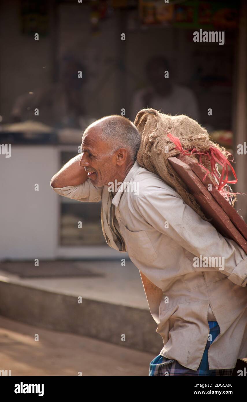 Indian man porter carrying hi-res stock photography and images - Alamy