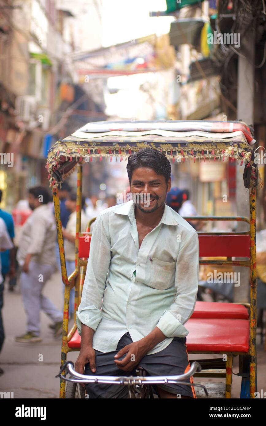Friendly Indian rickshaw driver in the narrow streets of Chandi Chowk ...