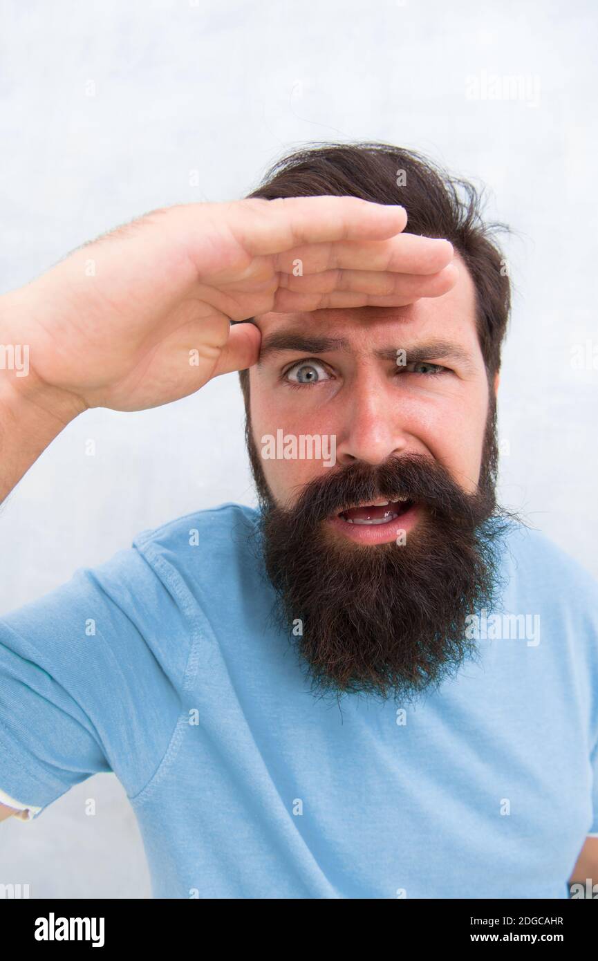 Suspicious look. Man bearded hipster stylish beard grey background ...