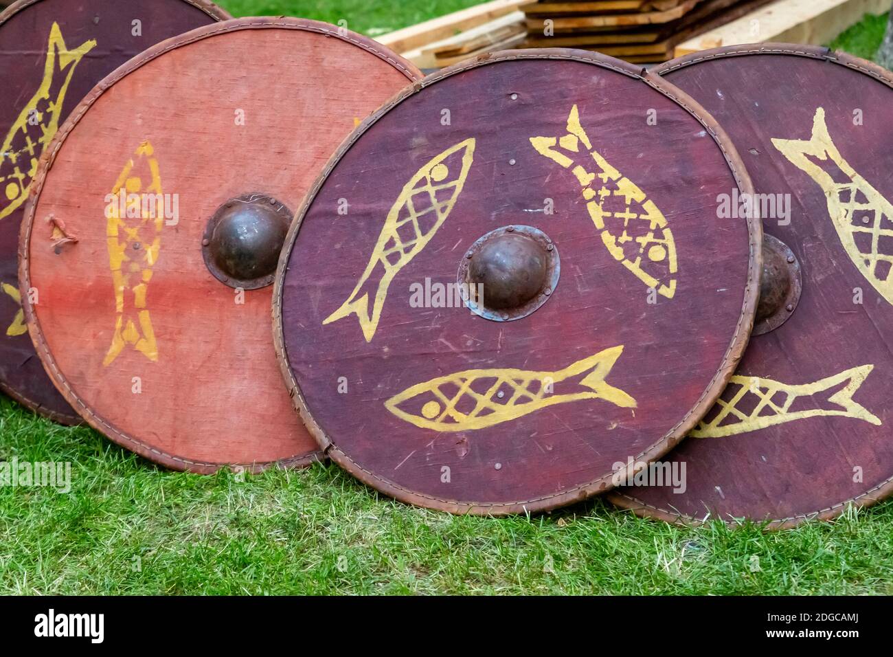 Set of traditional wooden shields, round red patterned fish, disposable ...