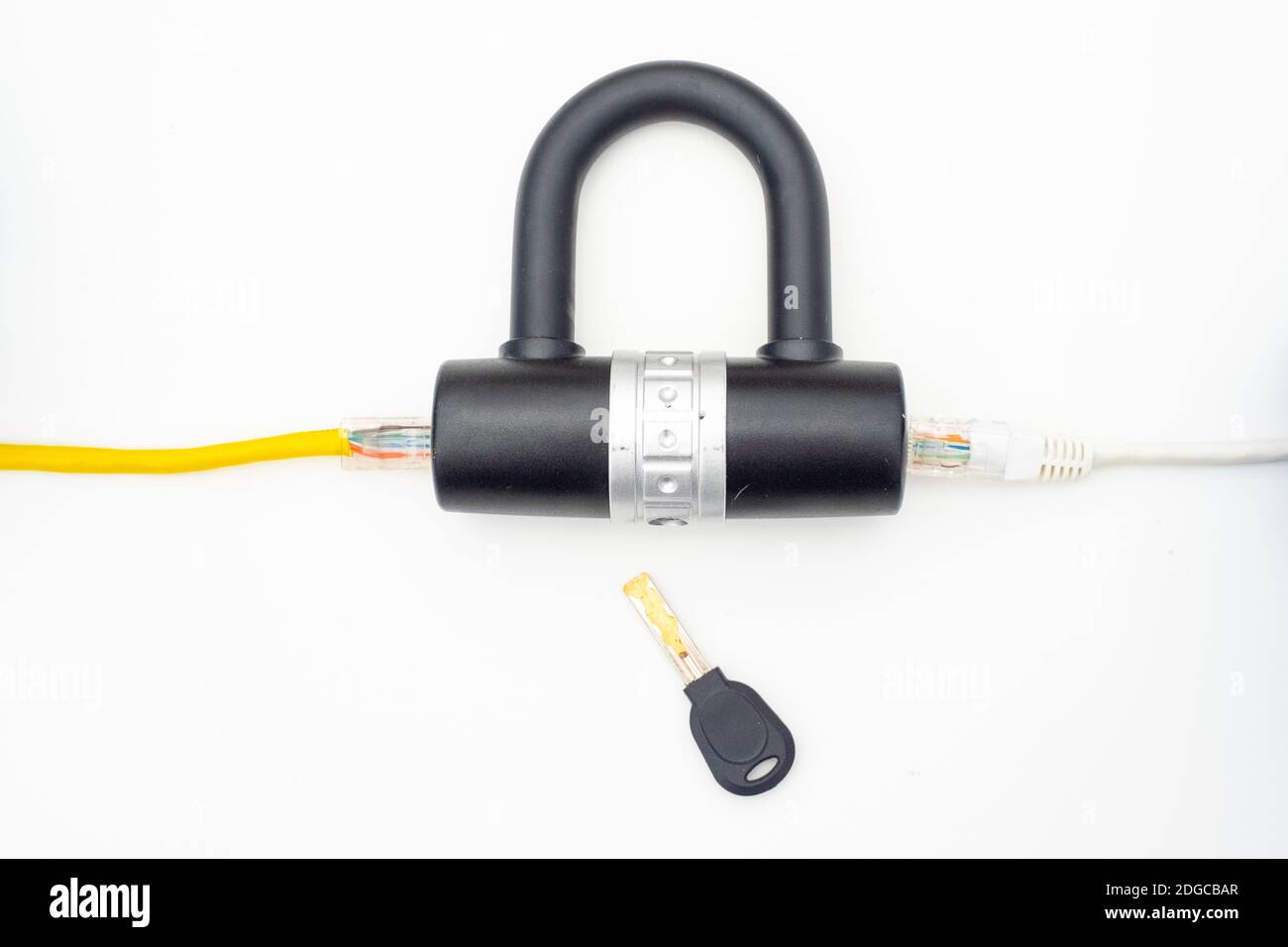 Two computer network cables going through a lock with a key Stock Photo ...