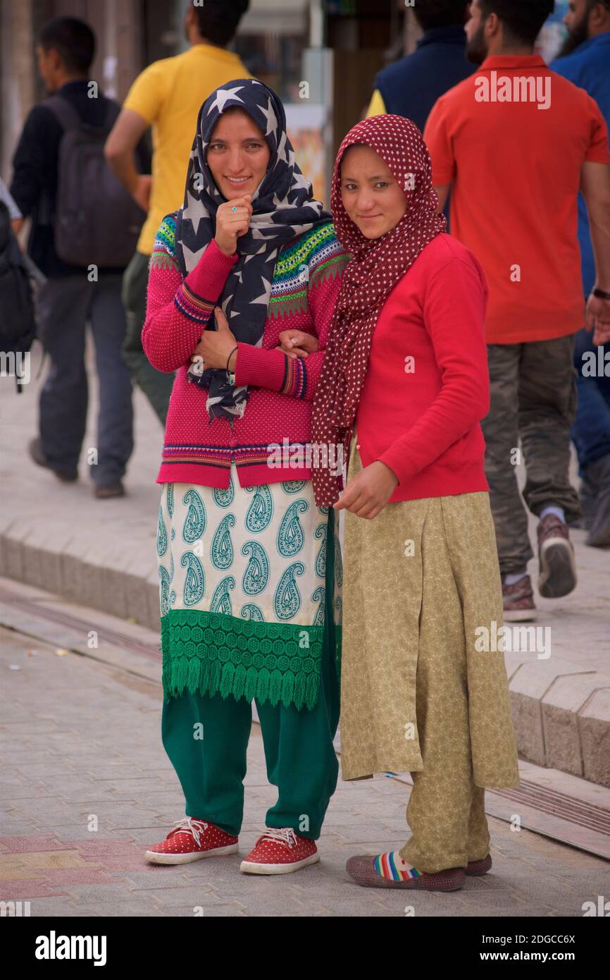 Indian women wearing headcloths, posing for a photograph. Leh, Ladakh ...