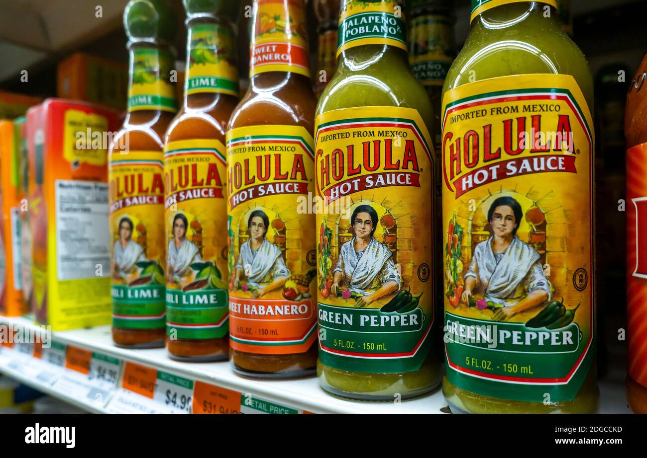 Bottles of Cholula brand hot sauce on supermarket shelves in New York ...