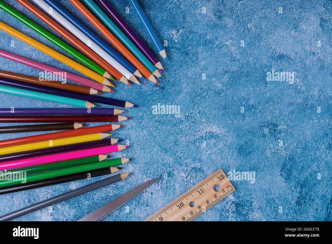 Back to school concept. Colored pencils, ruler, scissors Stock Photo ...