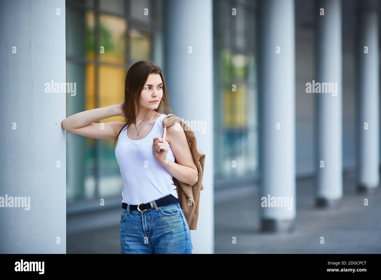 young girl stands near the building Stock Photo - Alamy