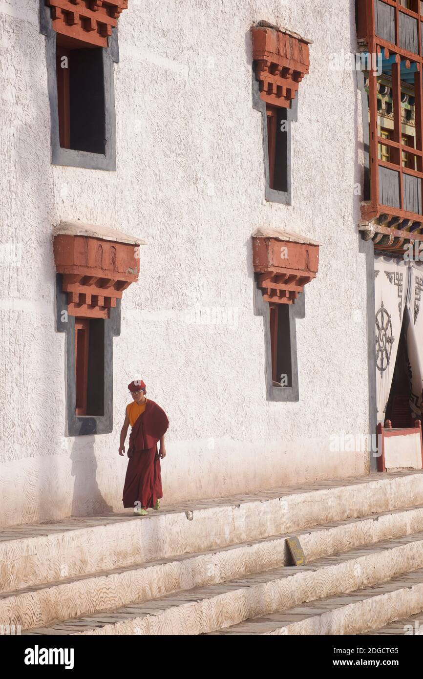 Early morning at Hemis monastery. A monk heading to the prayer hall ...