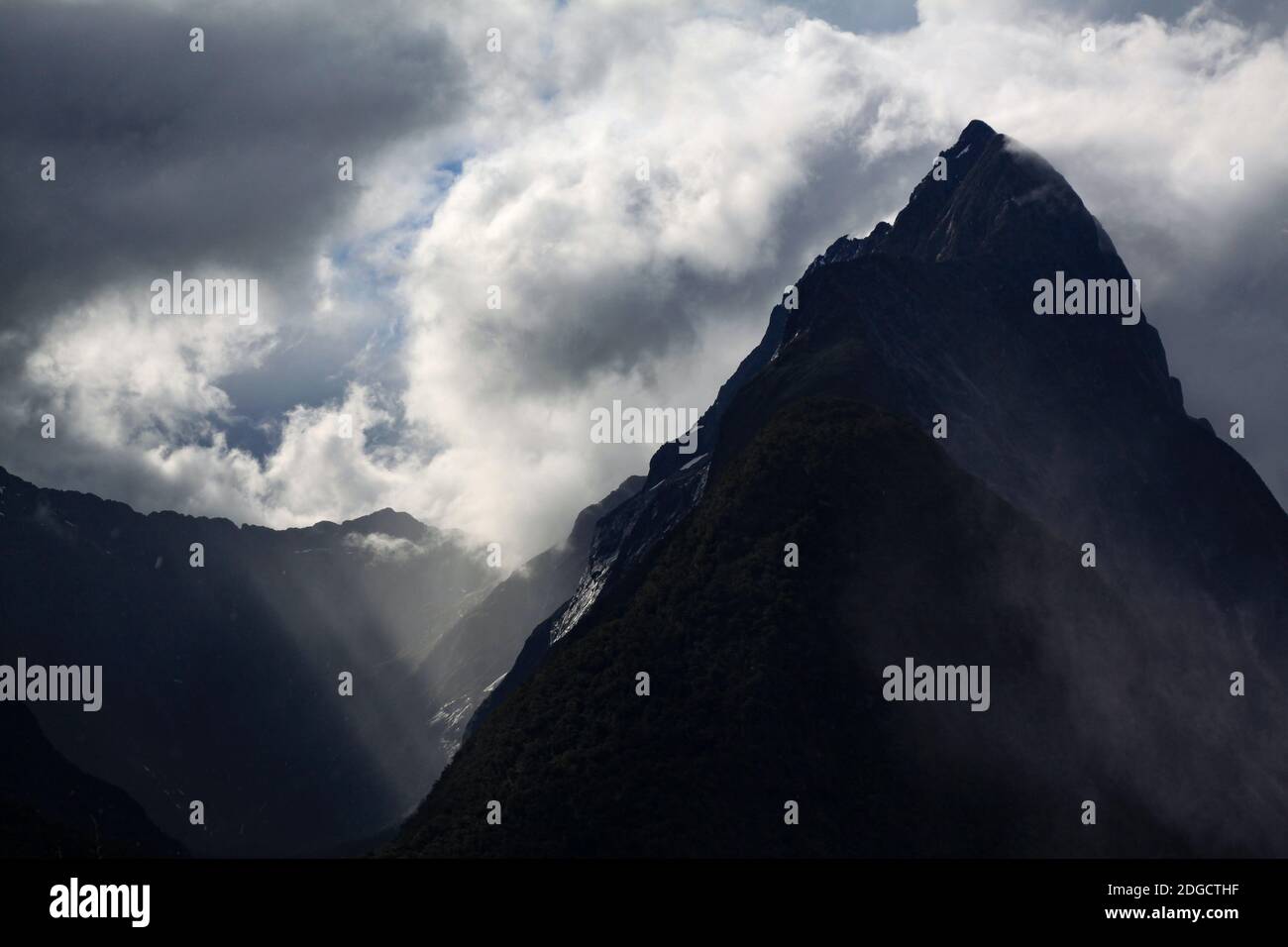 Light play mountain summit Stock Photo - Alamy