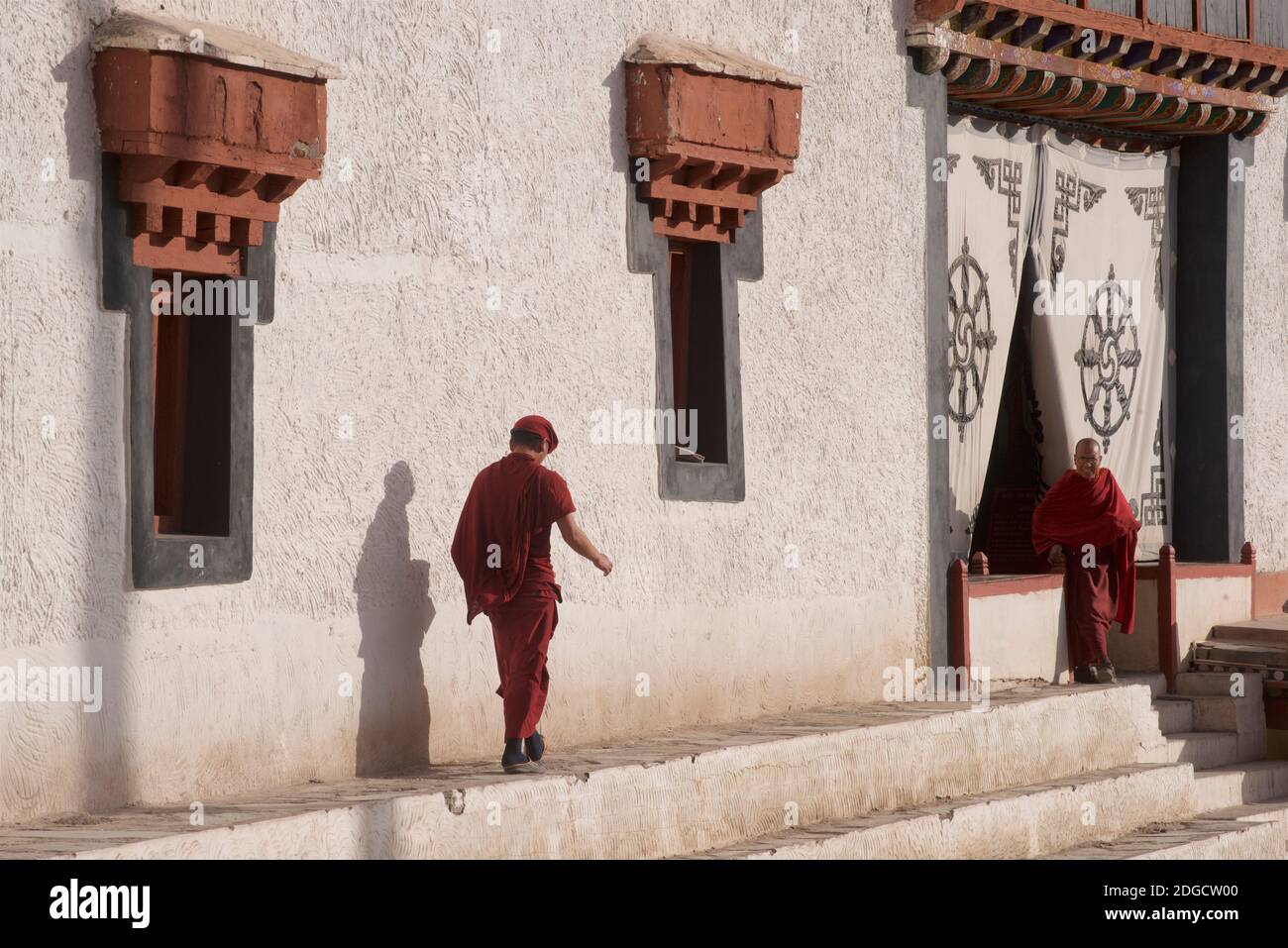 Early morning at Hemis monastery.Two monks heading to the prayer hall ...