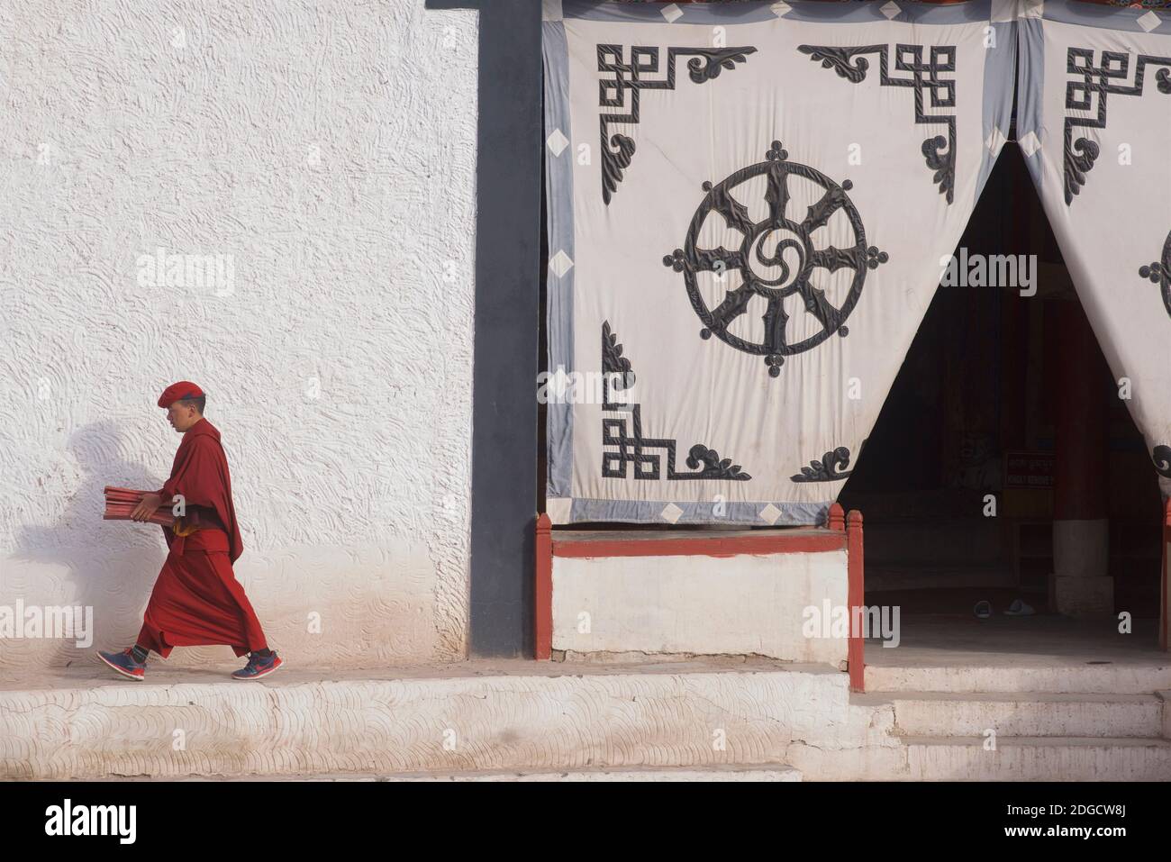Early morning at Hemis monastery. A monk walking from the prayer hall ...
