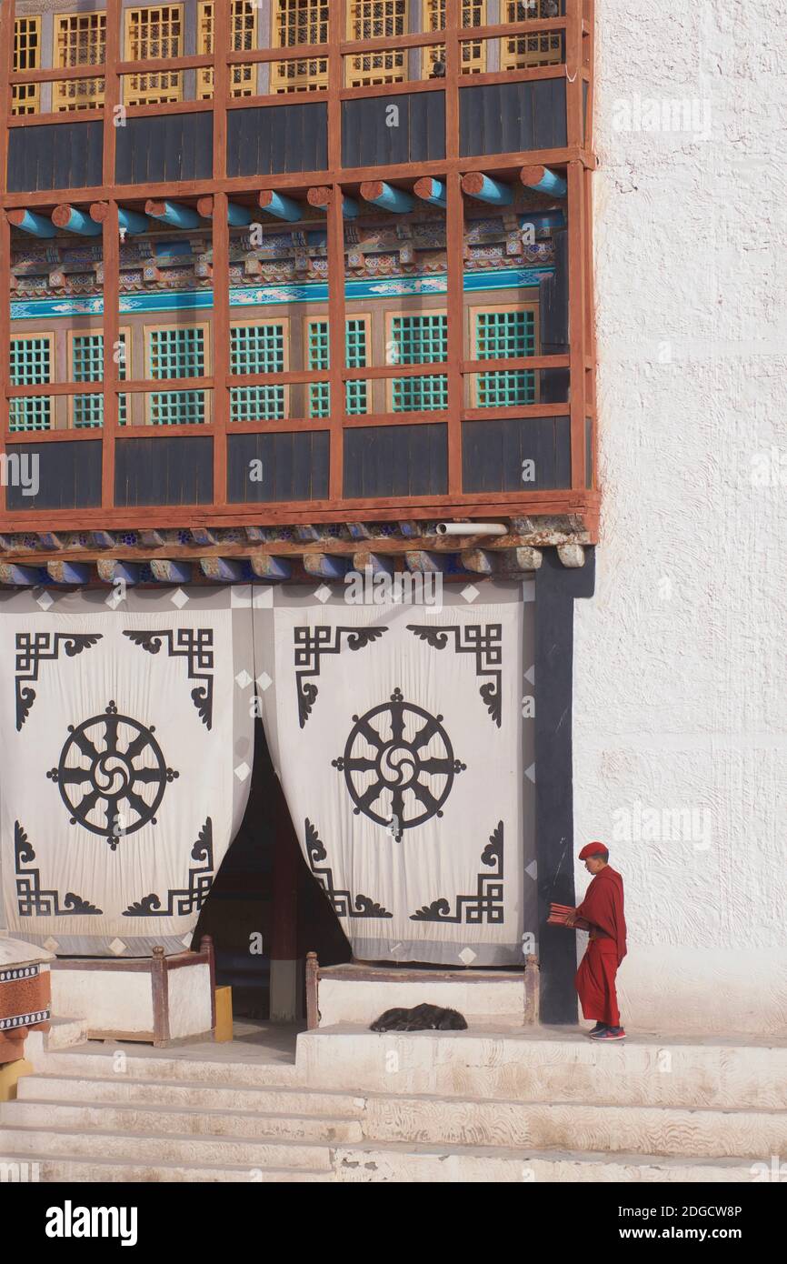 Early morning at Hemis monastery. A monk heading to the prayer hall ...