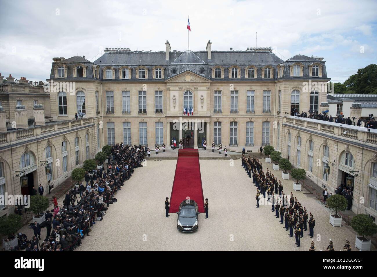French newly elected President Emmanuel Macron is welcomed by his ...