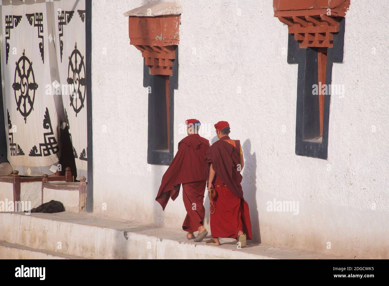 Early morning at Hemis monastery.Two monks heading to the prayer hall ...