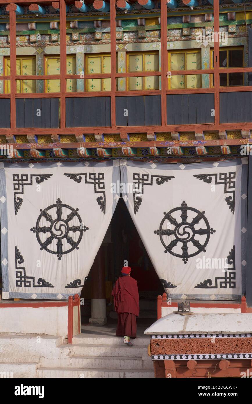 Early morning at Hemis monastery. Monks entering the prayer hall. Hemis ...
