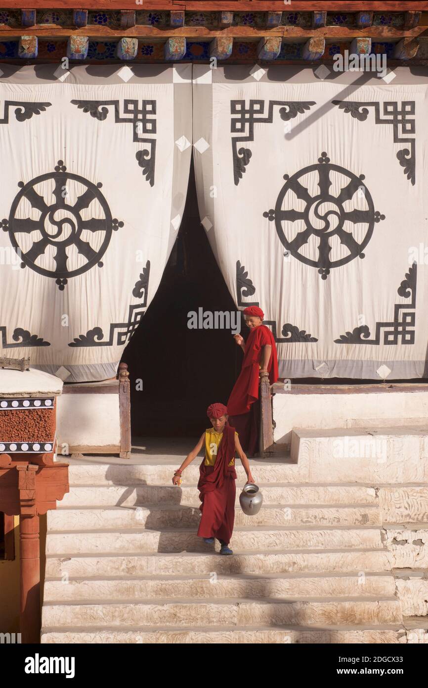 Early morning at Hemis monastery. Two young monks outside the prayer ...