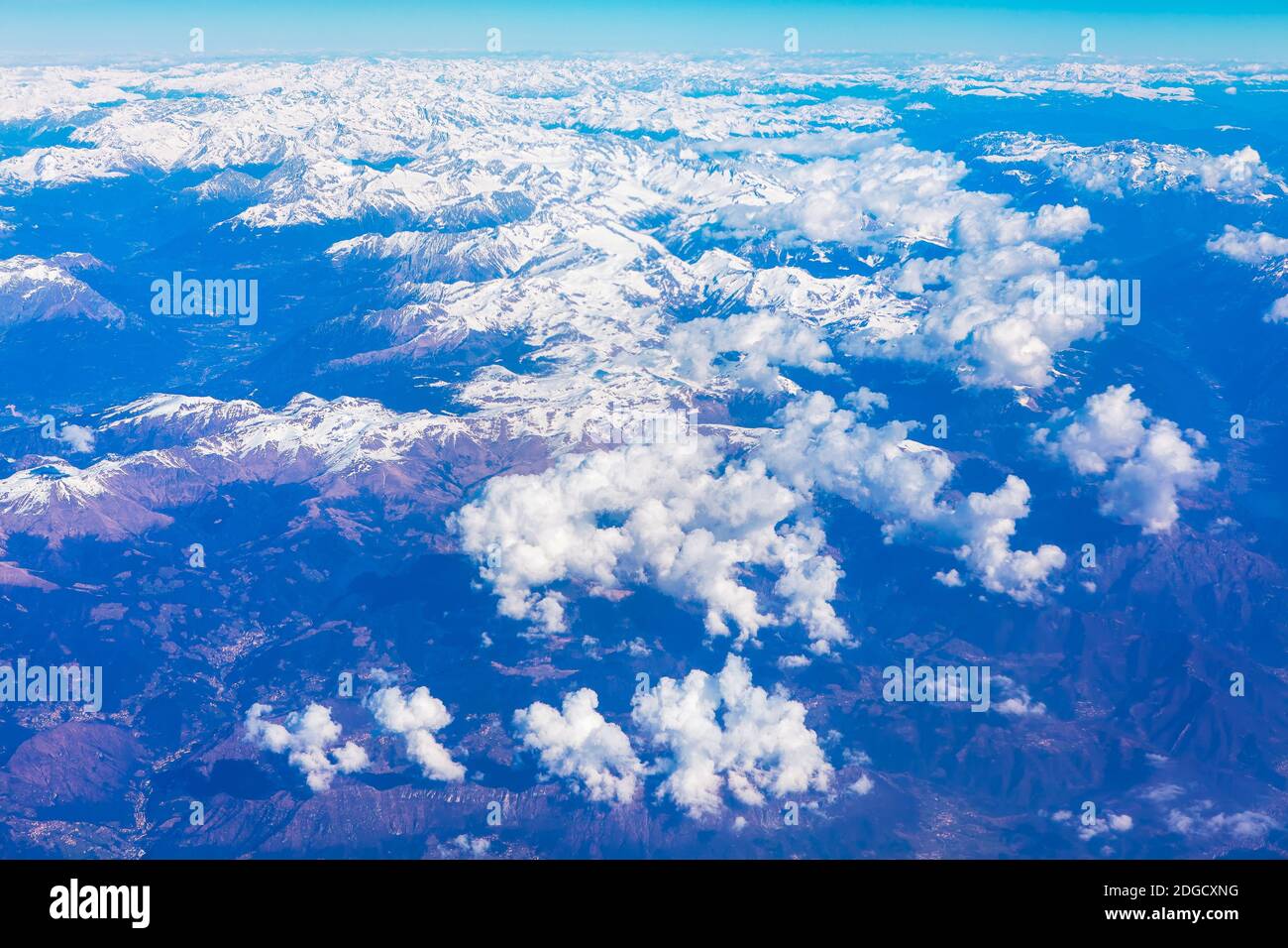 Clouds over the snowy mountains . Aerial view of winter scenery Stock ...