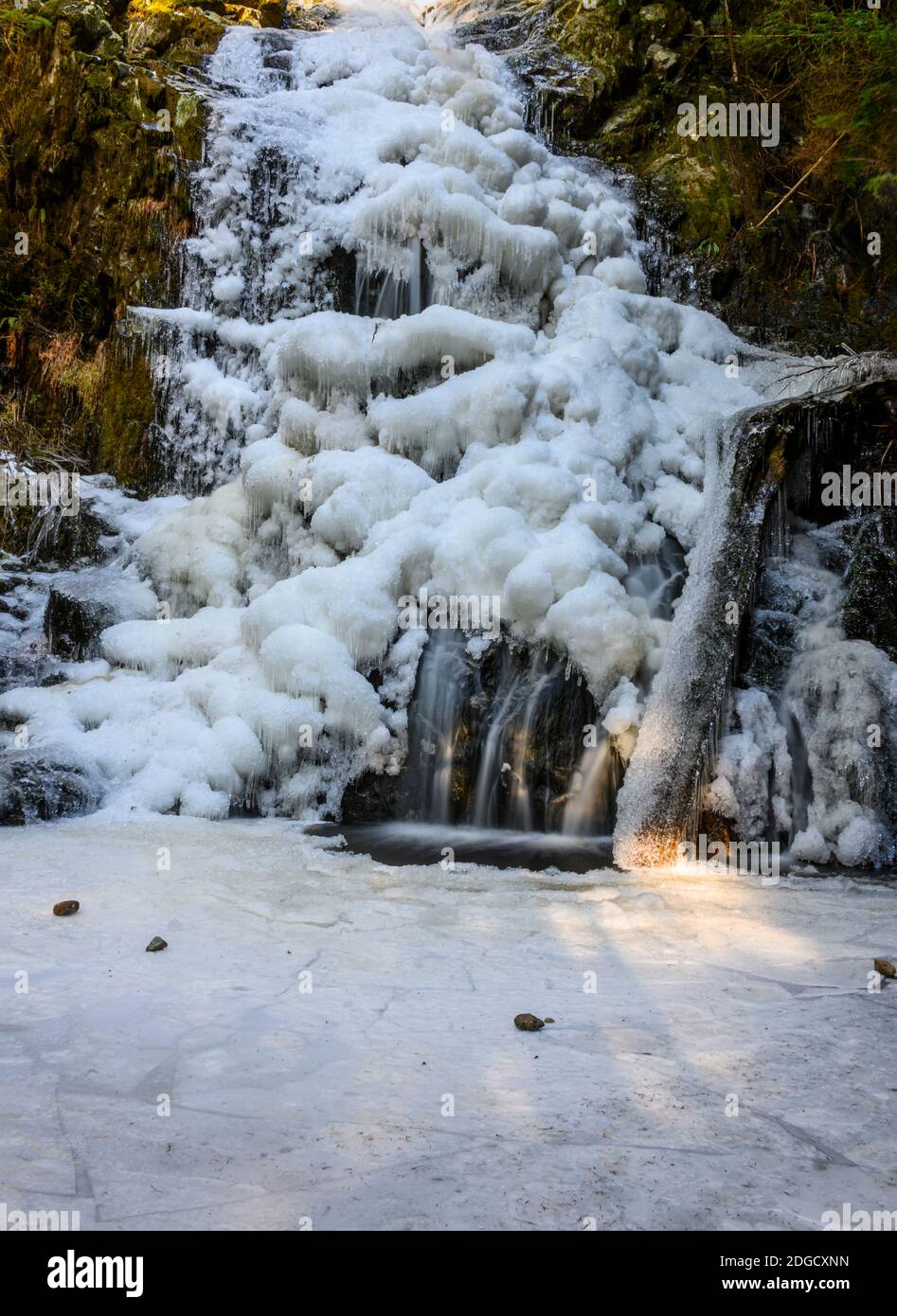 Beautiful frozen waterfall in the winter. Frozen water an ice ...