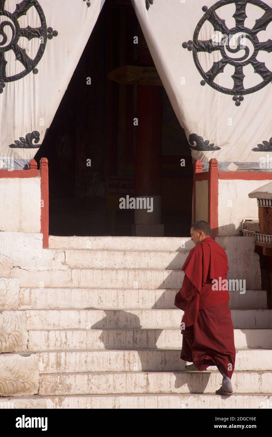 Early morning at Hemis monastery. A monk heading to the prayer hall ...