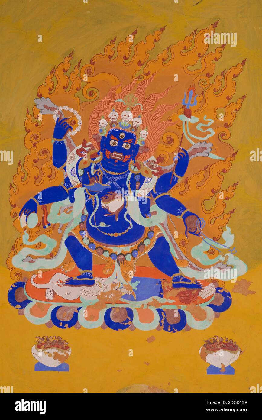 Tibetan buddhism. Painted wall mural of a Mahakala with skull tiara at ...