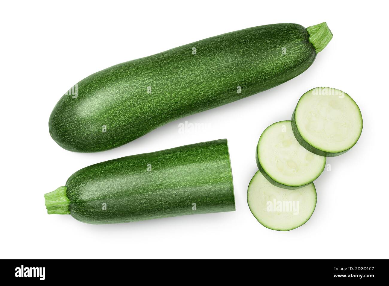Fresh whole and sliced zucchini isolated on white background with ...