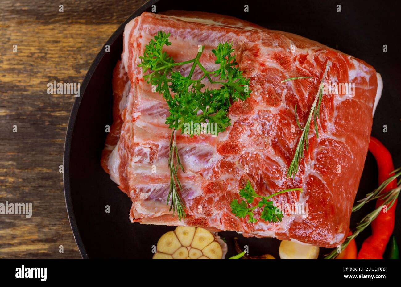 Pork chops on ribs uncooked, ready to grill Stock Photo - Alamy