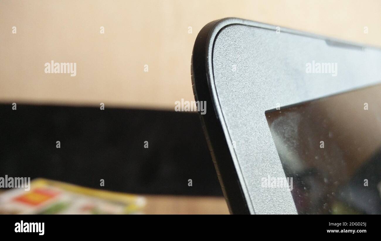 A closeup shot of the corner of a laptop screen Stock Photo - Alamy