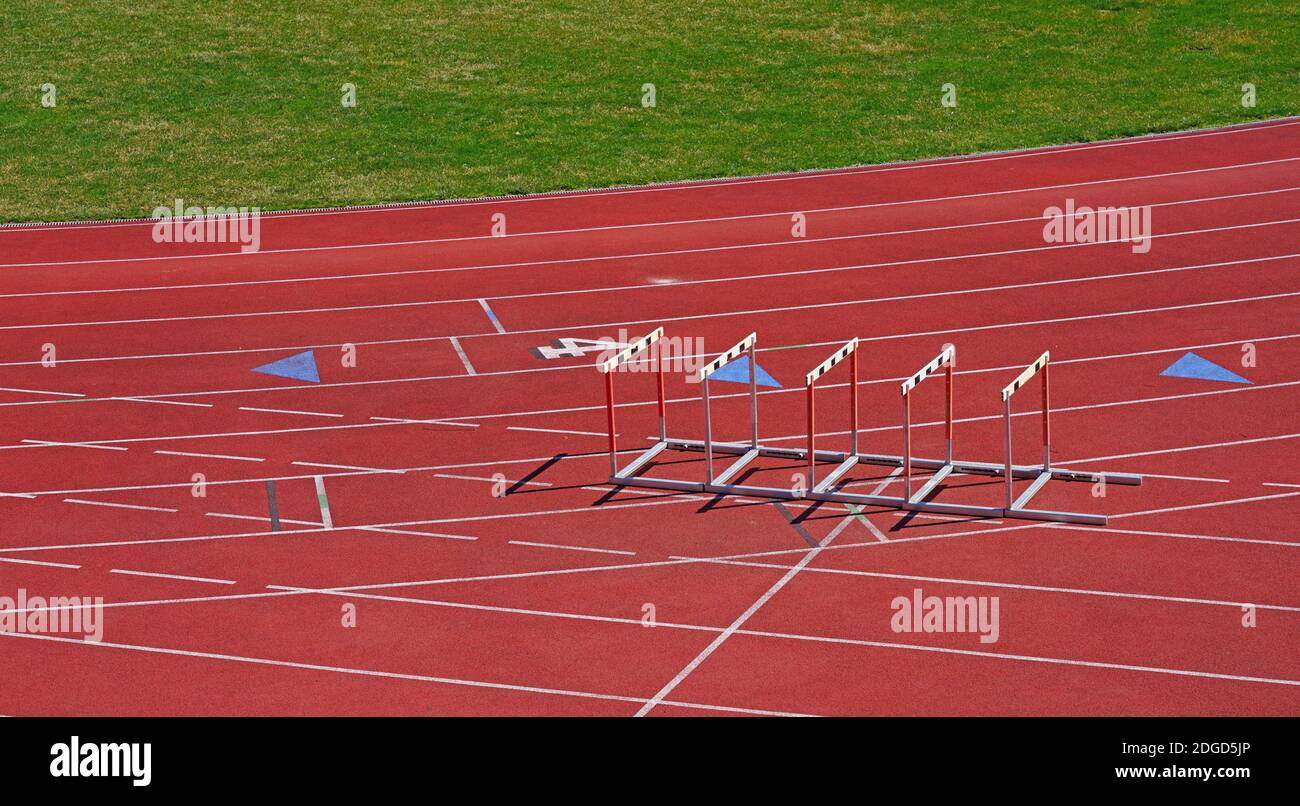 View of a red track and field Stock Photo - Alamy