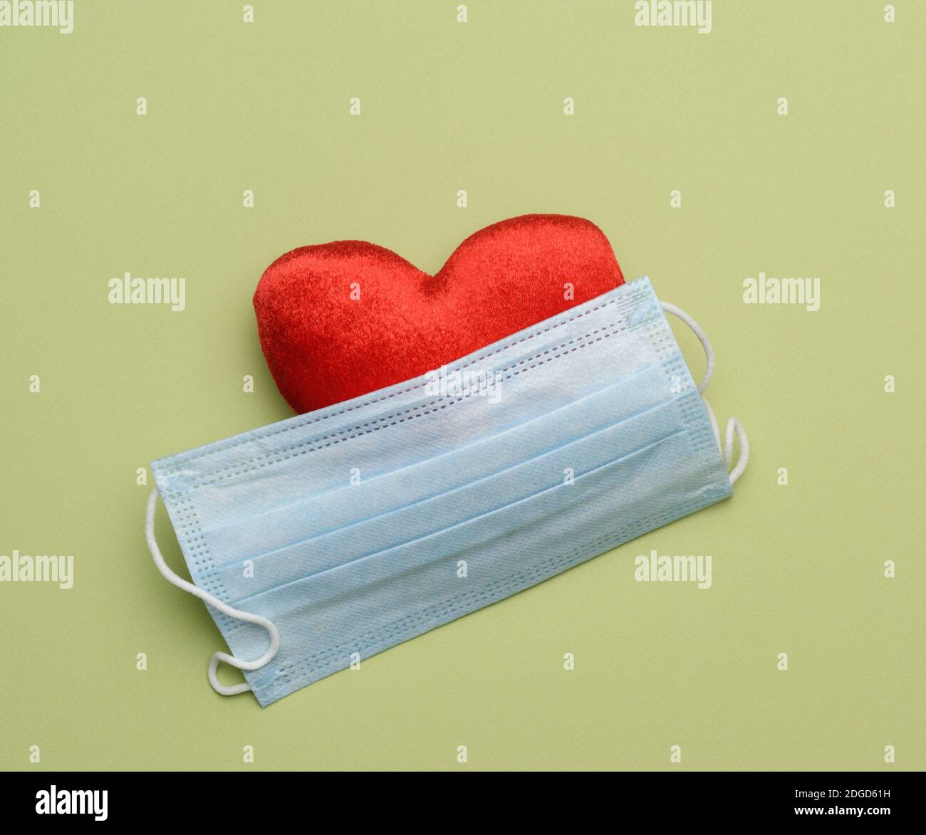 disposable masks on a green background, hygiene and virus protection ...