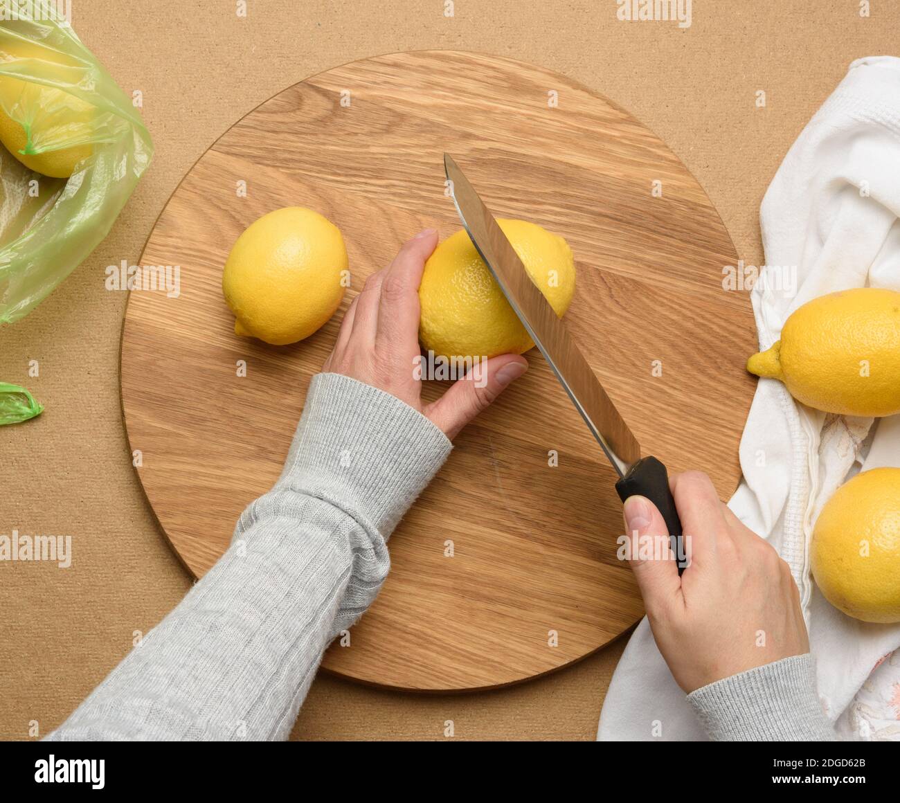 Female hand cuts yellow hi-res stock photography and images - Alamy