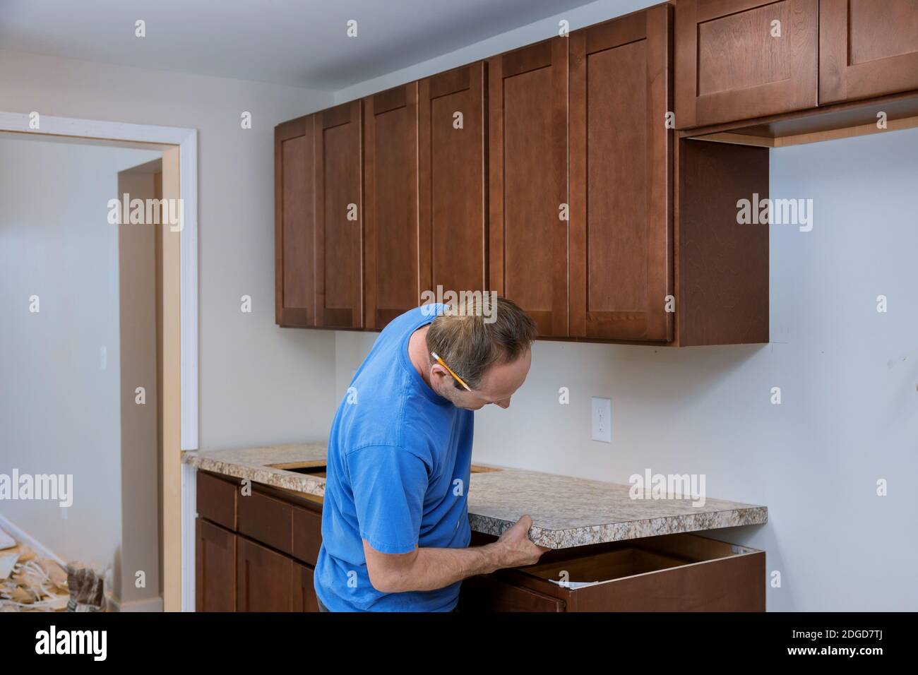 Installing contractors a laminate counter top a kitchen remodel Stock ...