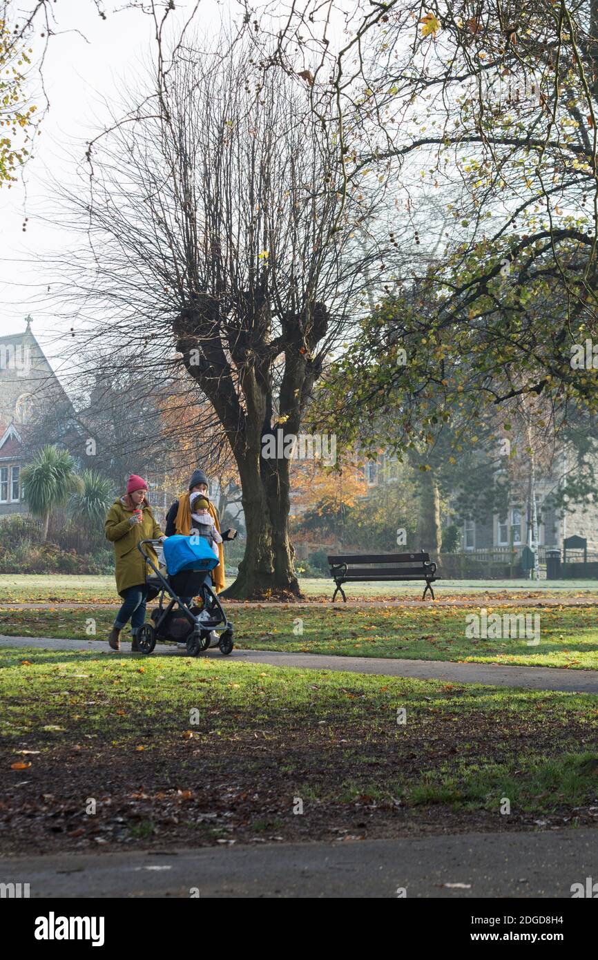 Mums walking in the park with young children Stock Photo - Alamy