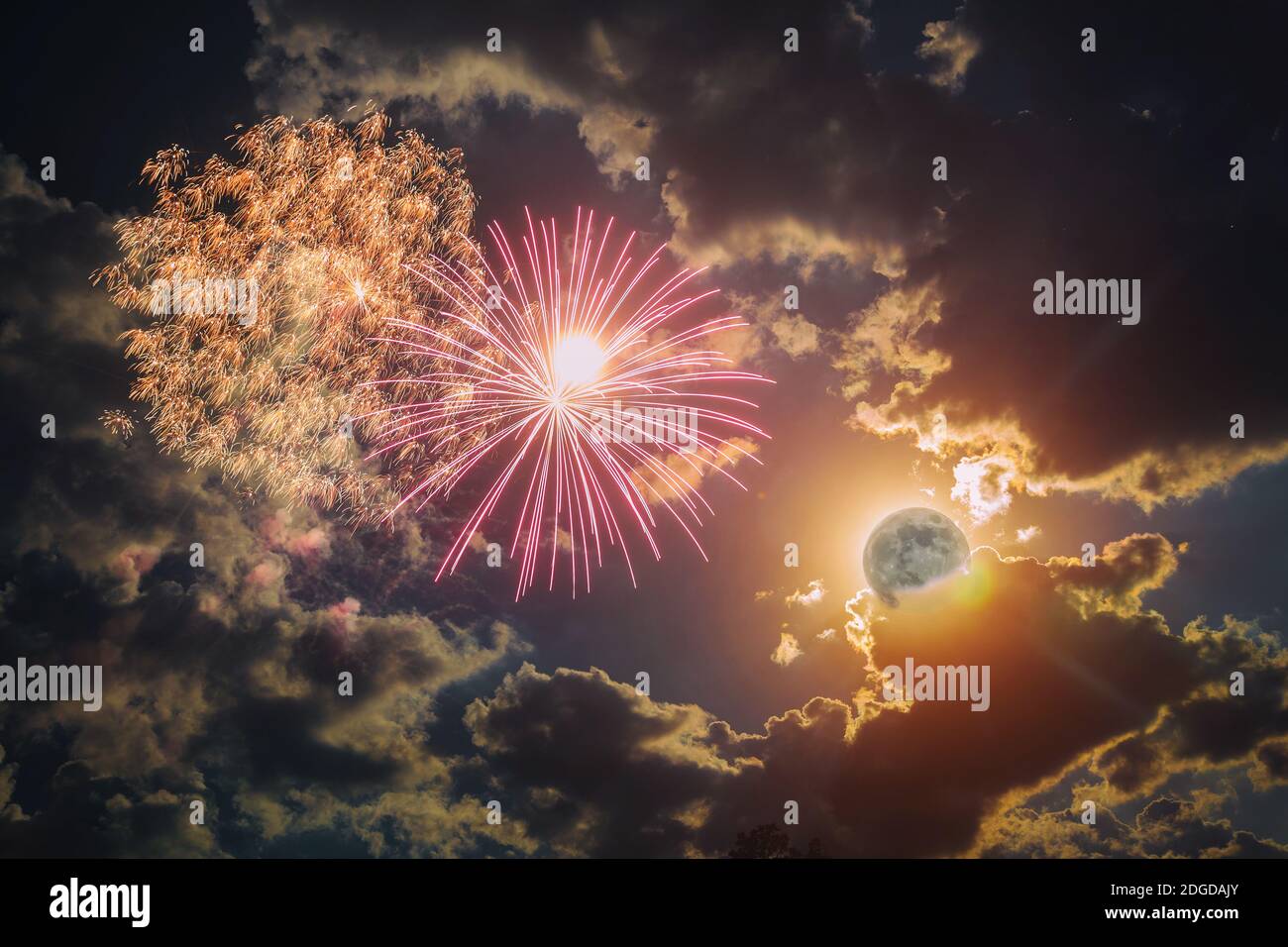 Amazing fireworks with the full moon in a dark night Stock Photo - Alamy