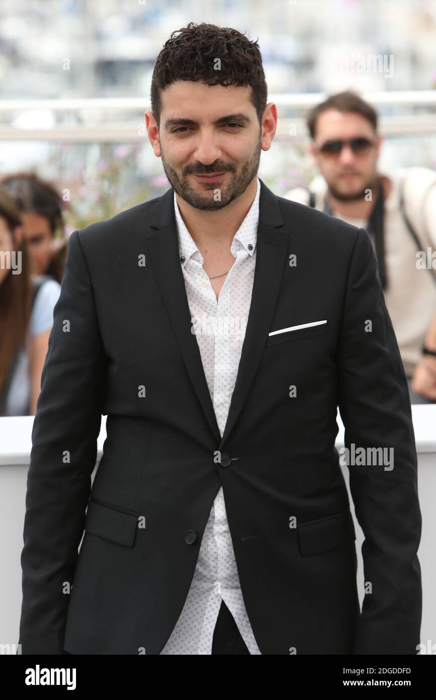 Karim Moussaoui posing at En Attendant Les Hirondelles photocall held ...
