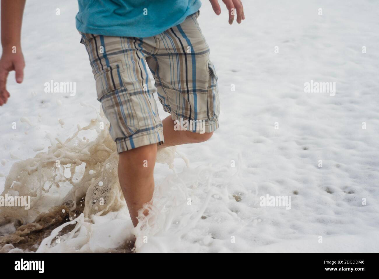 Child been splashed hi-res stock photography and images - Alamy
