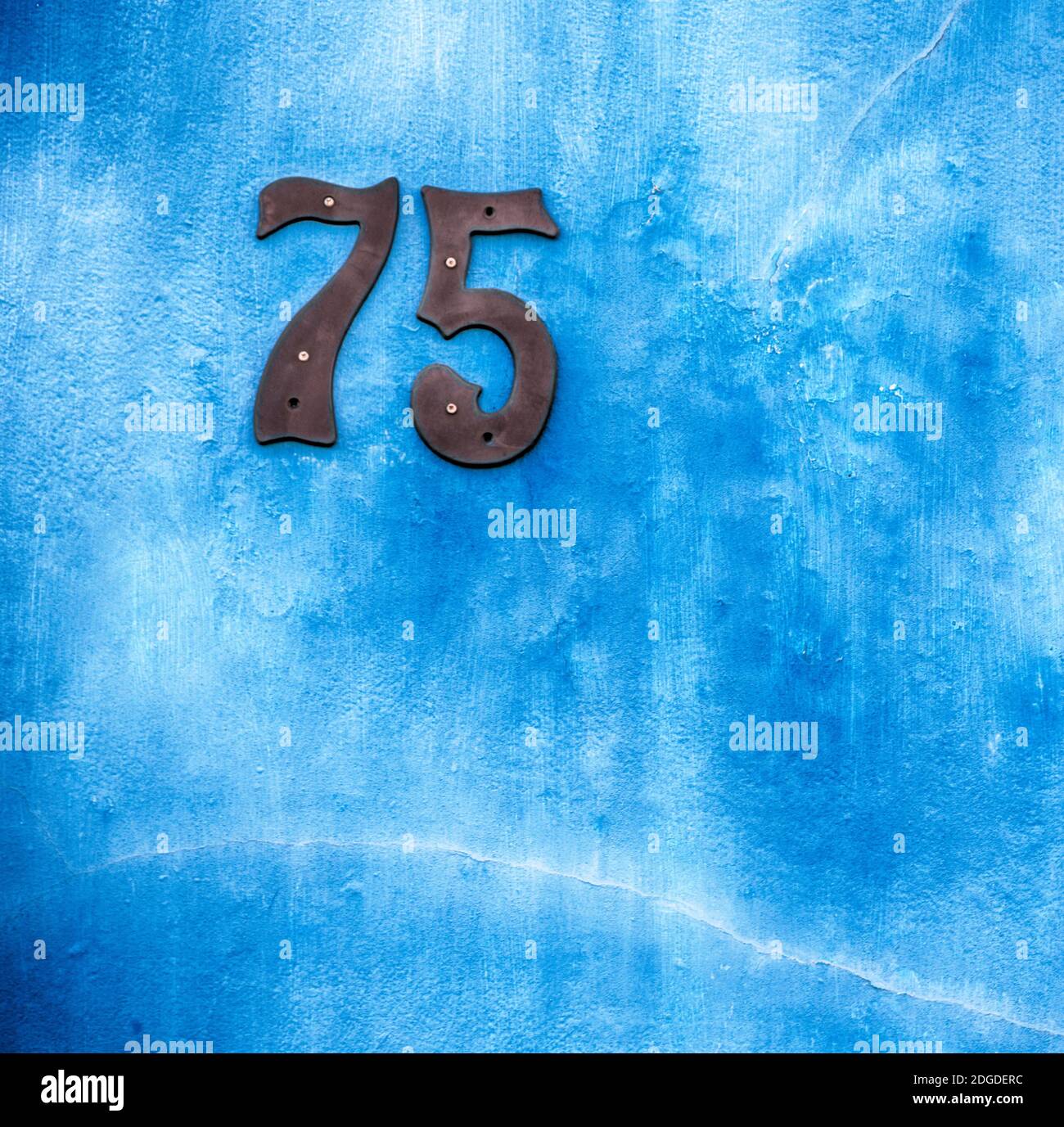 Number in a wall house like texture background Stock Photo - Alamy
