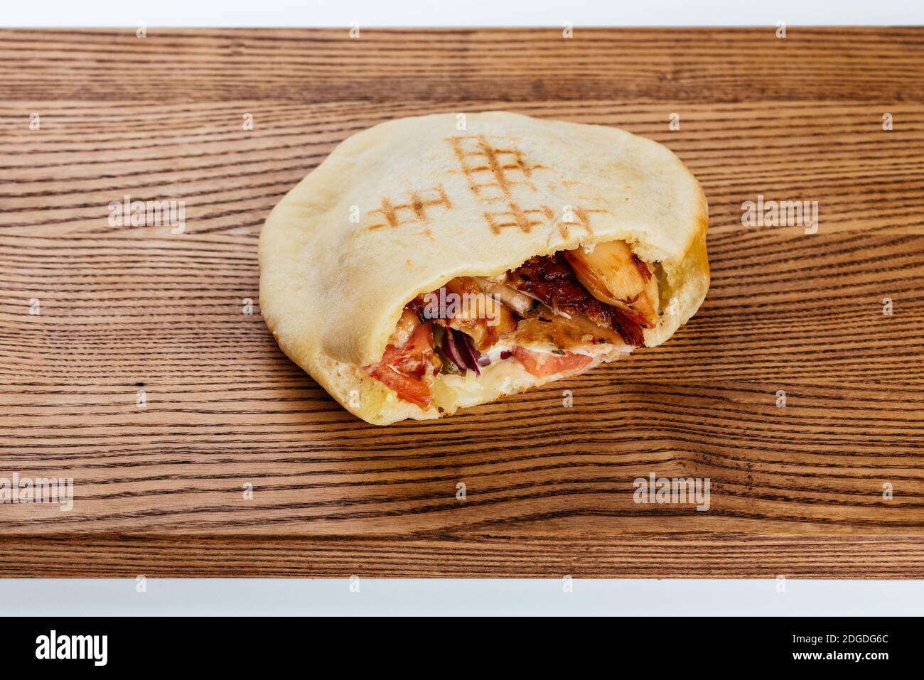 Turkish Shawarma on a wooden Board and light background Stock Photo - Alamy