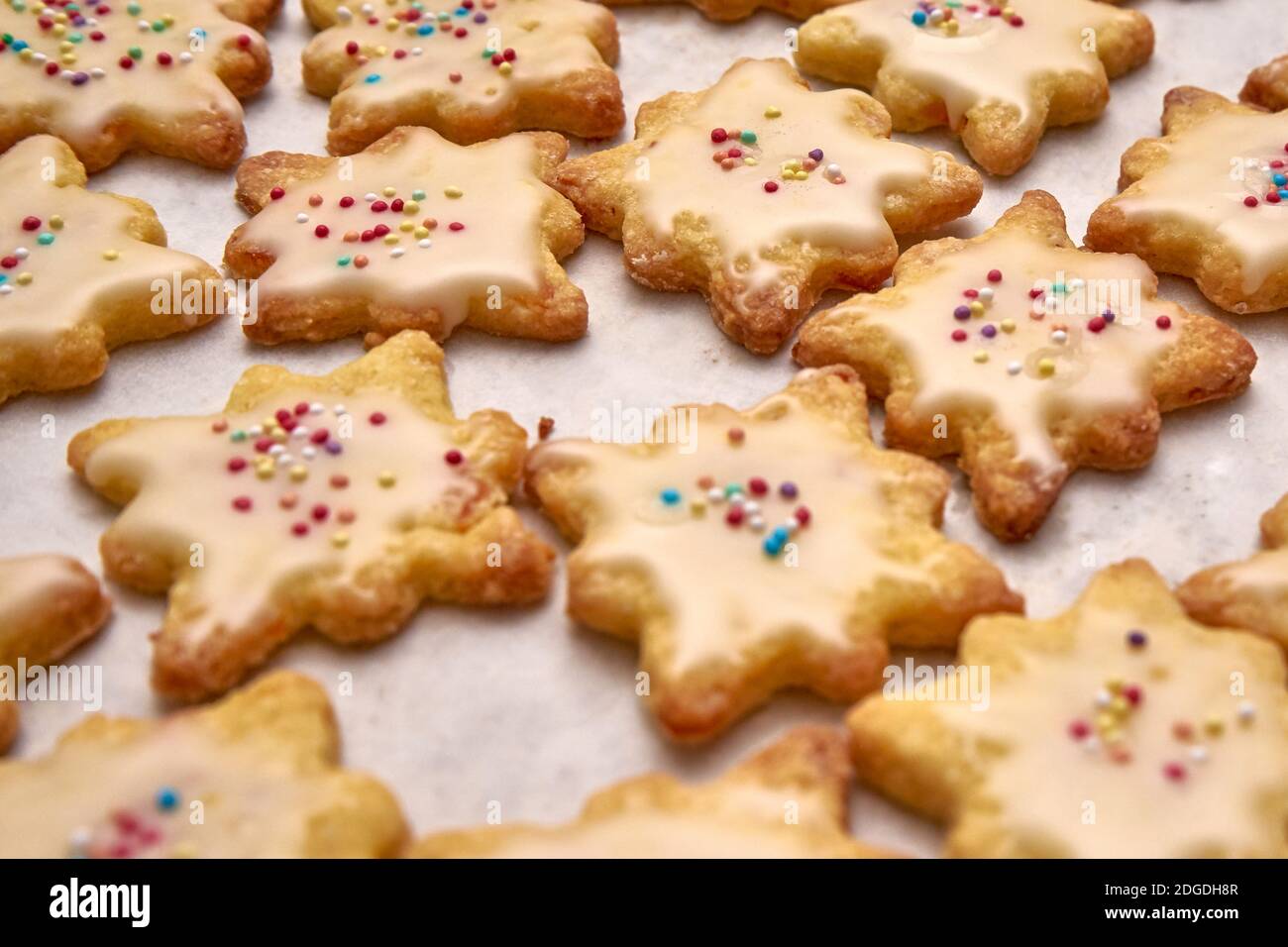 Biscuits Coated With Sugar Icing With Decorative Color Balls On A Sheet ...