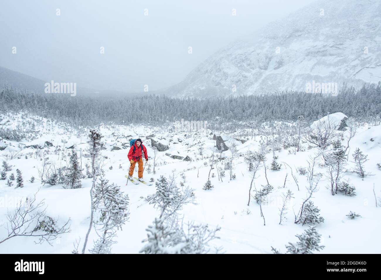 Man skiing through a boulder field in the alpine Stock Photo - Alamy