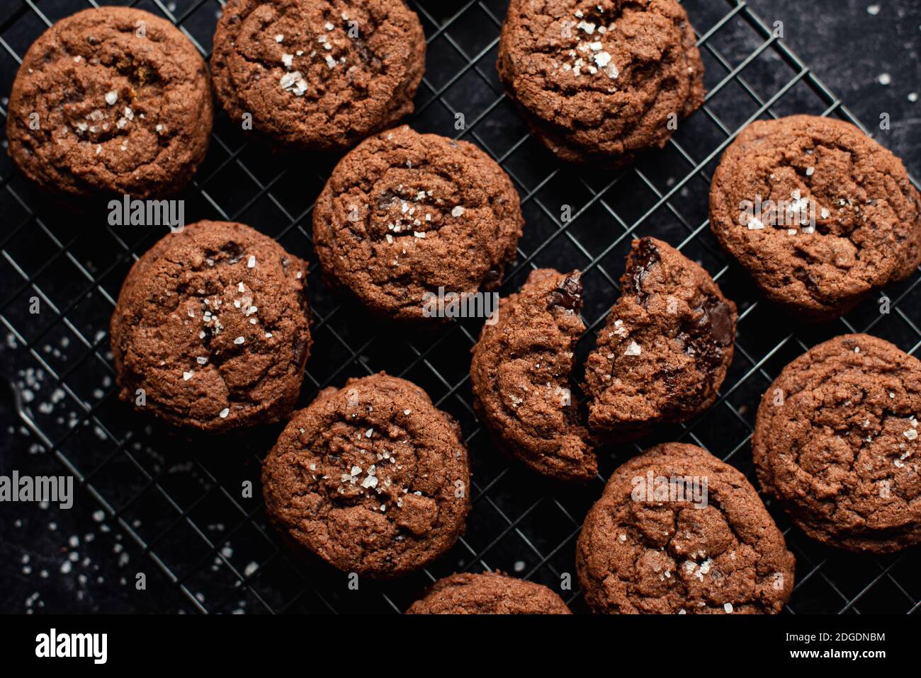 Overhead view of salted dark chocolate cookies on black counter Stock ...