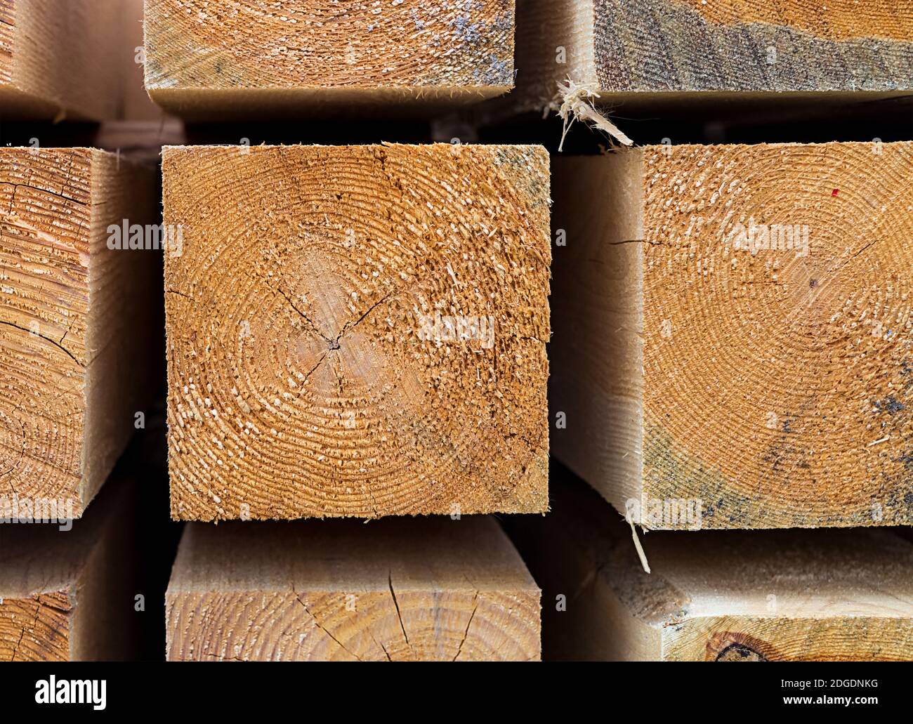Building materials house stack of beams close-up, light square ...
