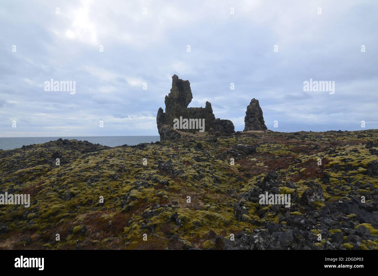Beautiful landscape with moss covered lava rock and londrangar rock ...