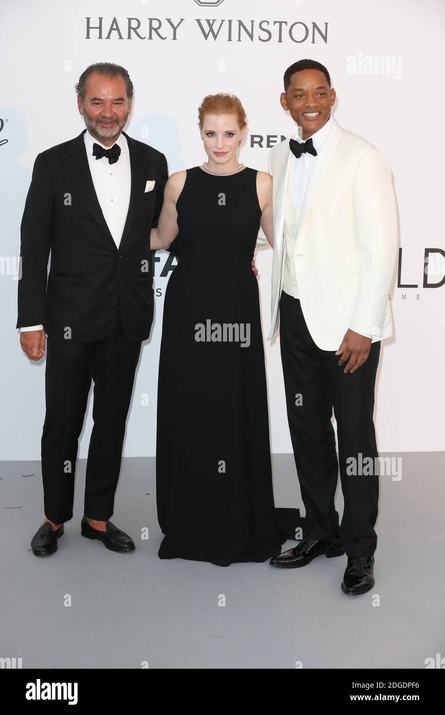 Remo Ruffini, Jessica Chastain and Will Smith attending the 24th amfAR ...