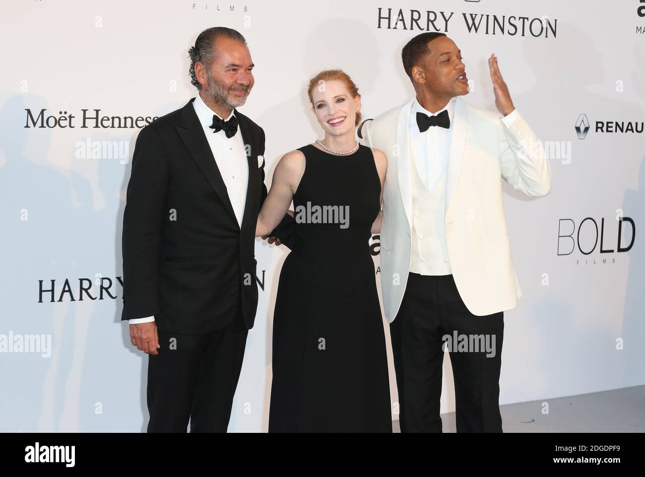 Remo Ruffini, Jessica Chastain and Will Smith attending the 24th amfAR ...