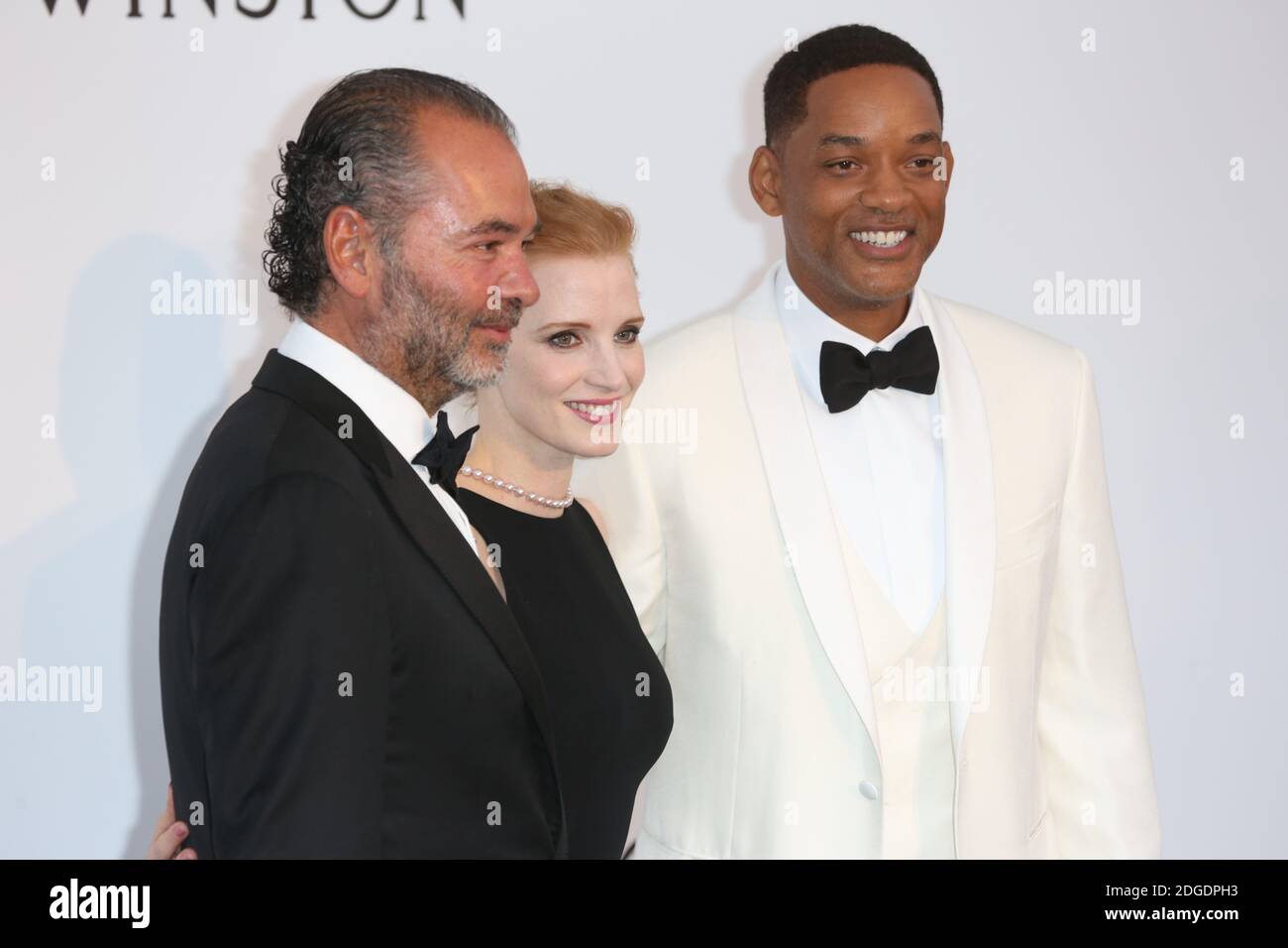 Remo Ruffini, Jessica Chastain and Will Smith attending the 24th amfAR ...