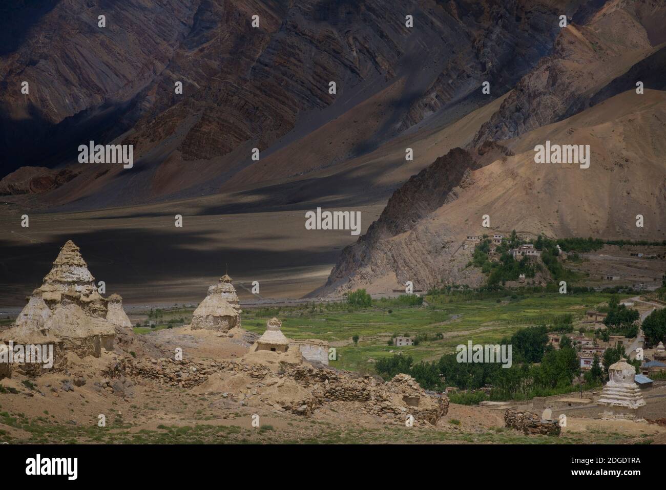 Stupas scattered on the hillside beneath Zangla Palace, Tsa-zar ...