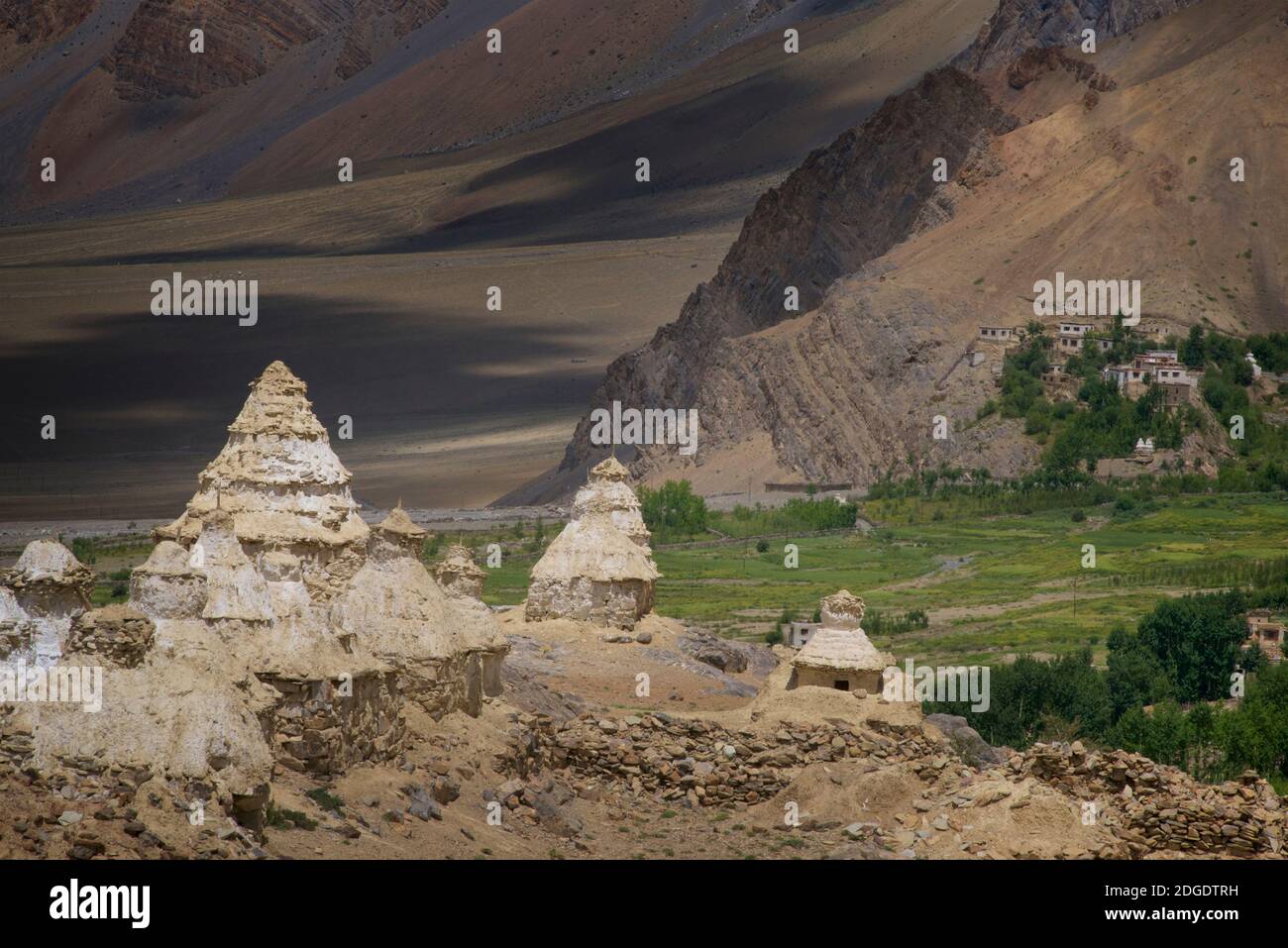 Stupas scattered on the hillside beneath Zangla Palace, Tsa-zar ...